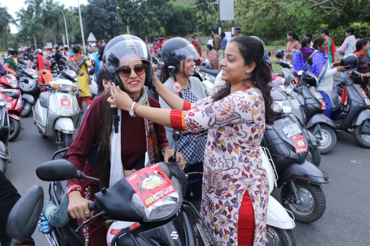 Raffles distributes 150 helmets for women safety to commemorate Women’s ...